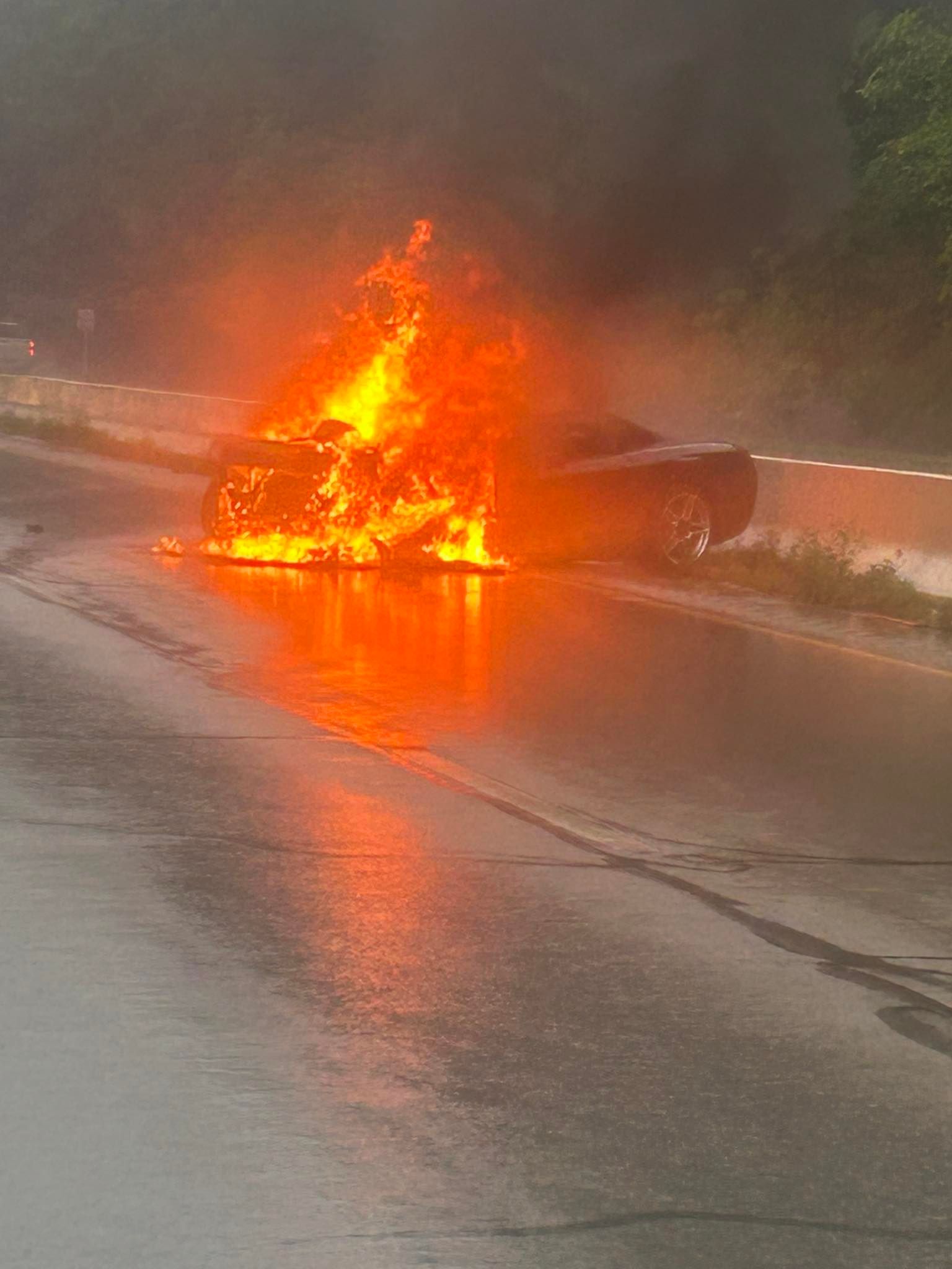 Firefighters battle severe weather while putting out car fire in ...