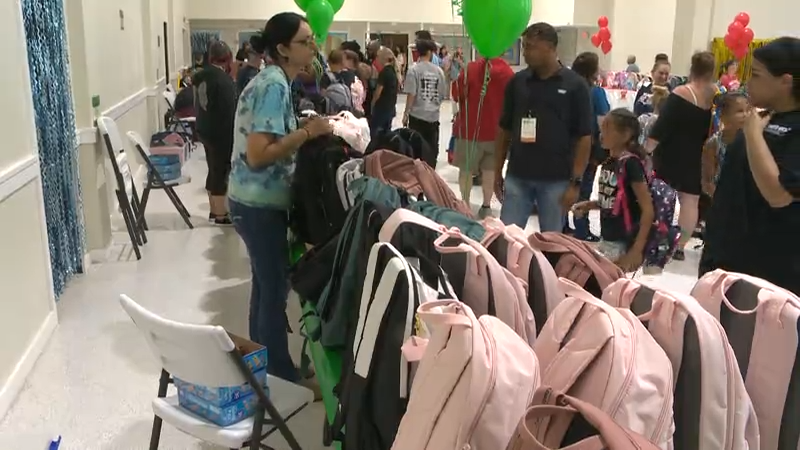 Warren Family Mission hands out backpacks, supplies for upcoming school ...