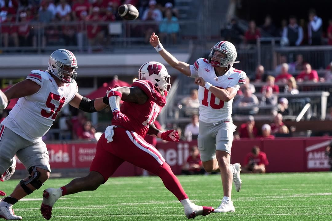 Sayin throws 4 TD passes as No. 1 Ohio State throttles Wisconsin 34-0 ...